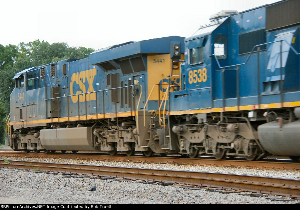 CSX 5441, 8538, and 581 heading North with a train of loaded well cars